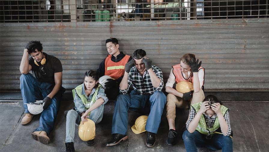 How do pay cuts and layoffs affect morale and productivity?